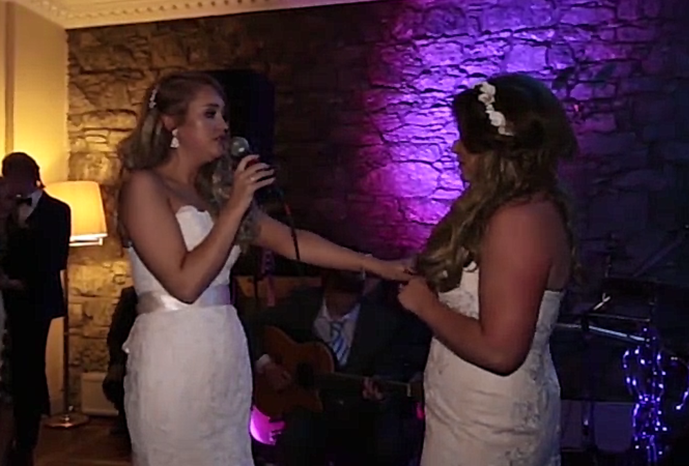 Woman brought to tears as her bride sings to her at their wedding ...