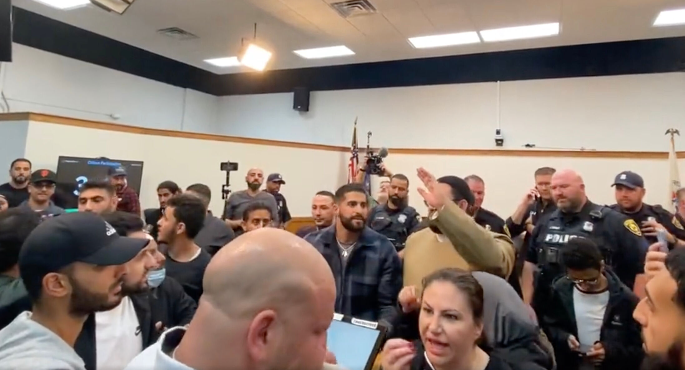 School board meeting descends into chaos as protestors demand book bans ...