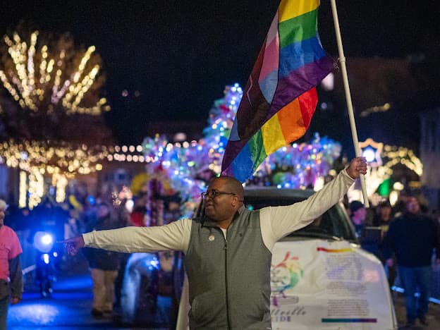 LGBTQ+ group marches in Christmas parade despite threats & town's ban ...